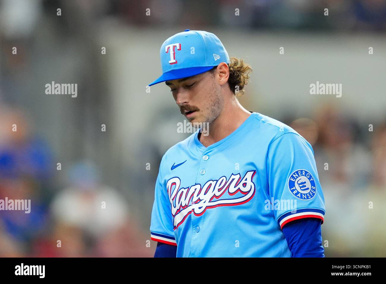 Texas Rangers pitcher Cole Winn walks toward the dugout after being ...