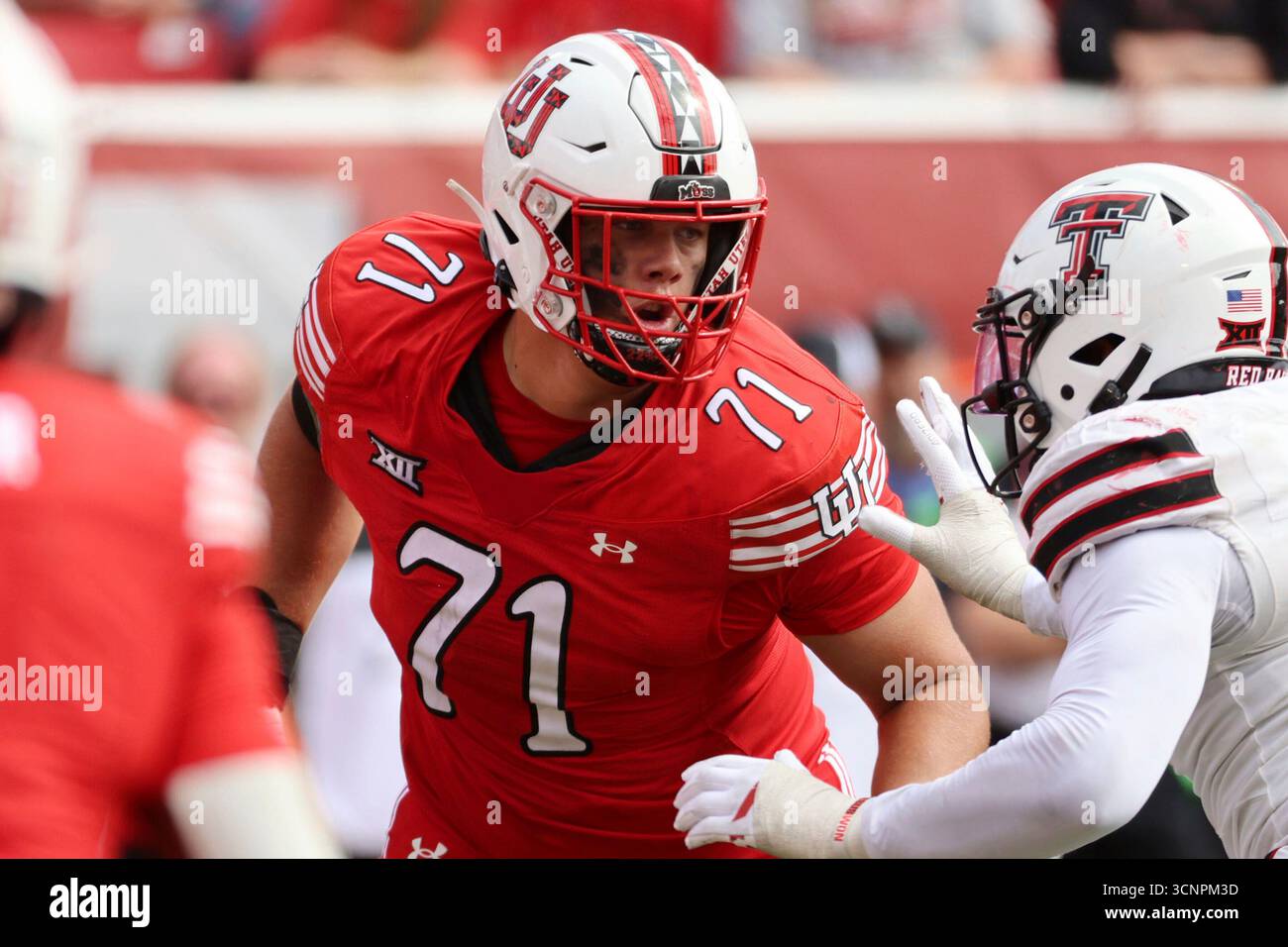 Utah offensive lineman Caleb Lomu blocks during an NCAA college ...