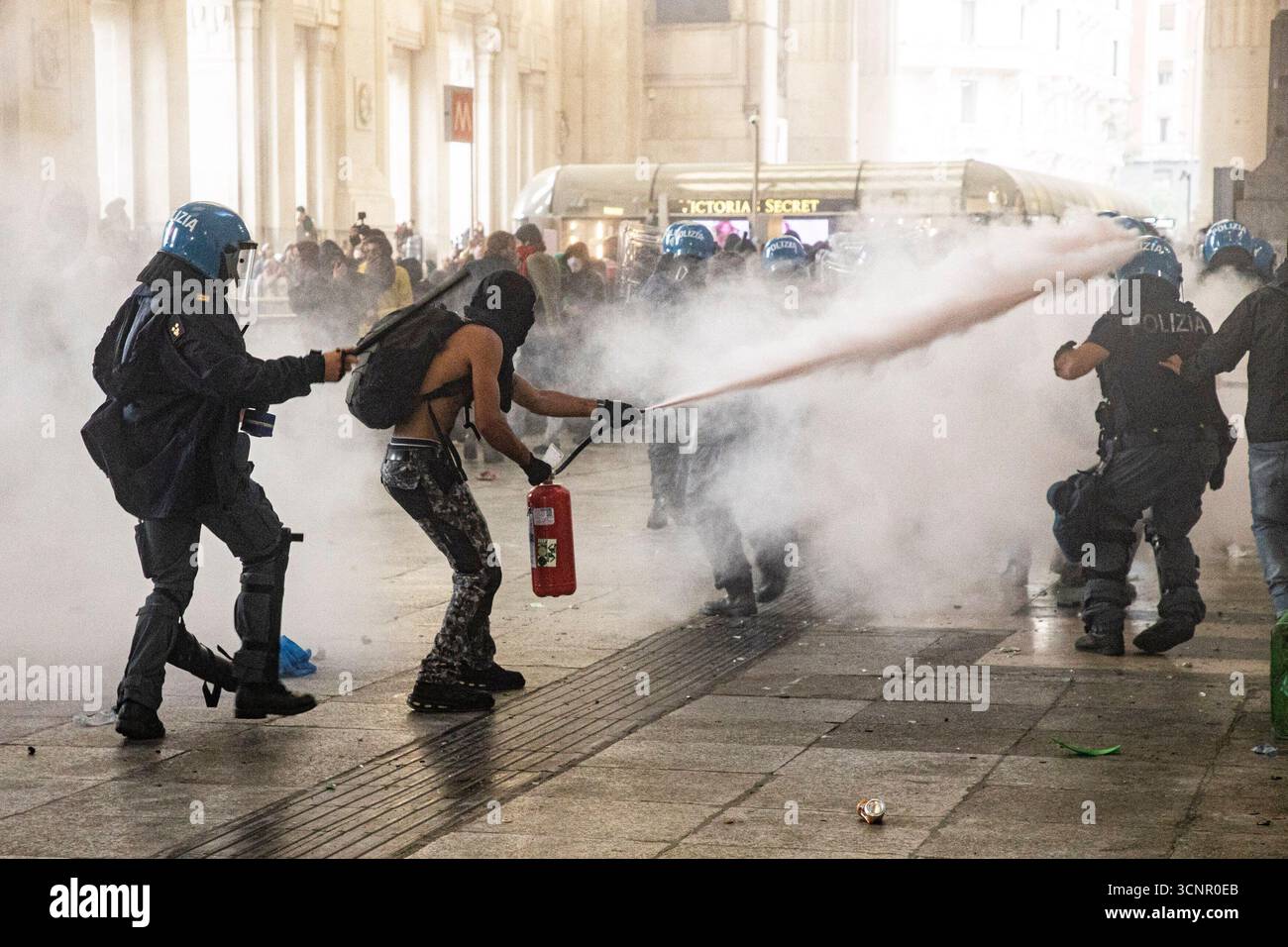 Protesters clash with riot police as they participate in a ...