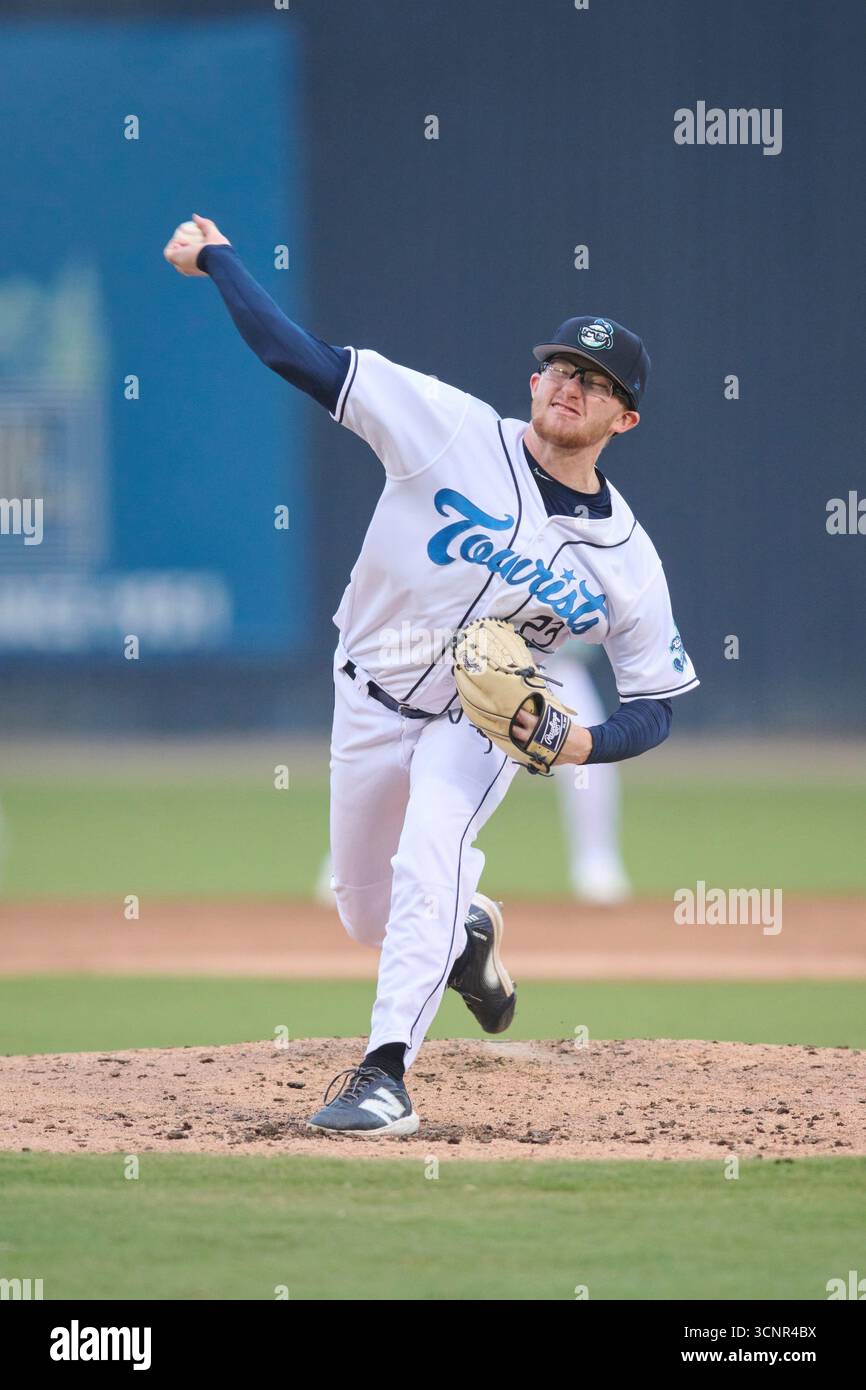 Asheville Tourists starting pitcher Dylan Howard (23) delivers a pitch ...