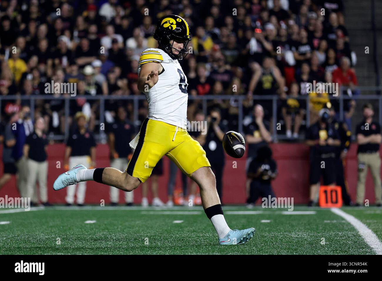 Iowa punter Rhys Dakin (9)kicks during an NCAA football game against ...