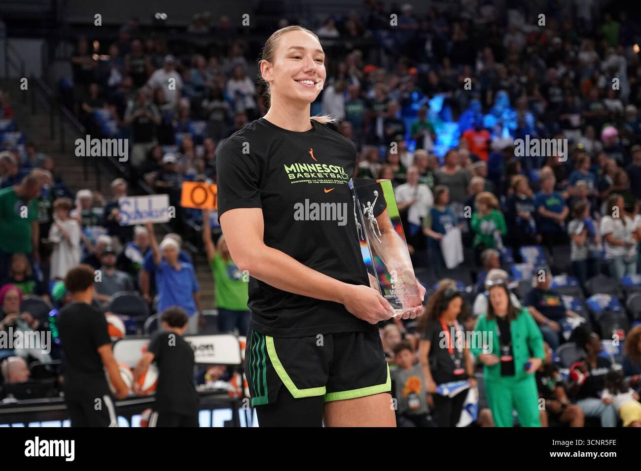 Minnesota Lynx forward Alanna Smith accepts the award for the 2025 Kia ...