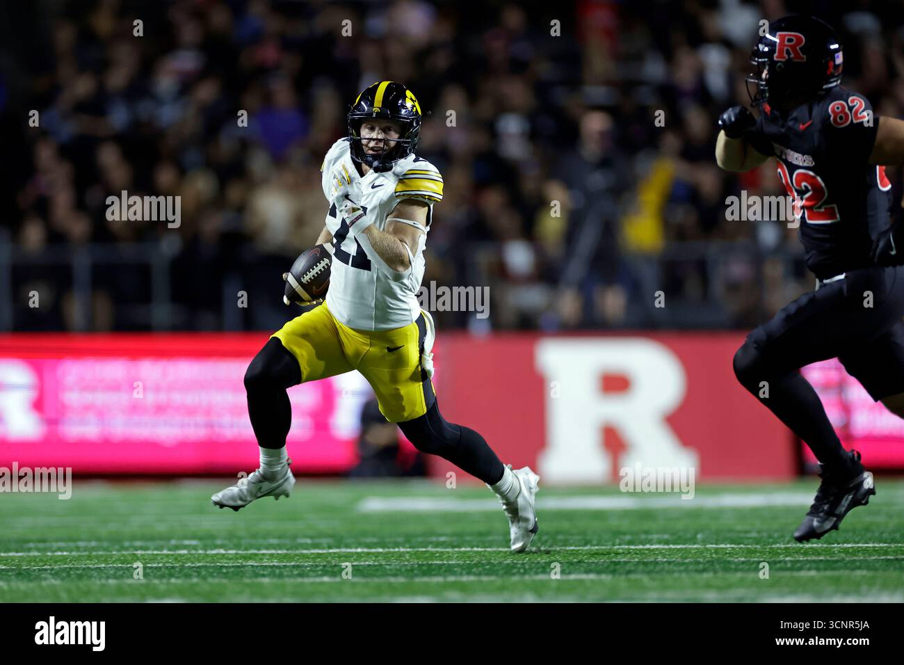 Iowa wide receiver Kaden Wetjen (21) runs with the ball during an NCAA ...