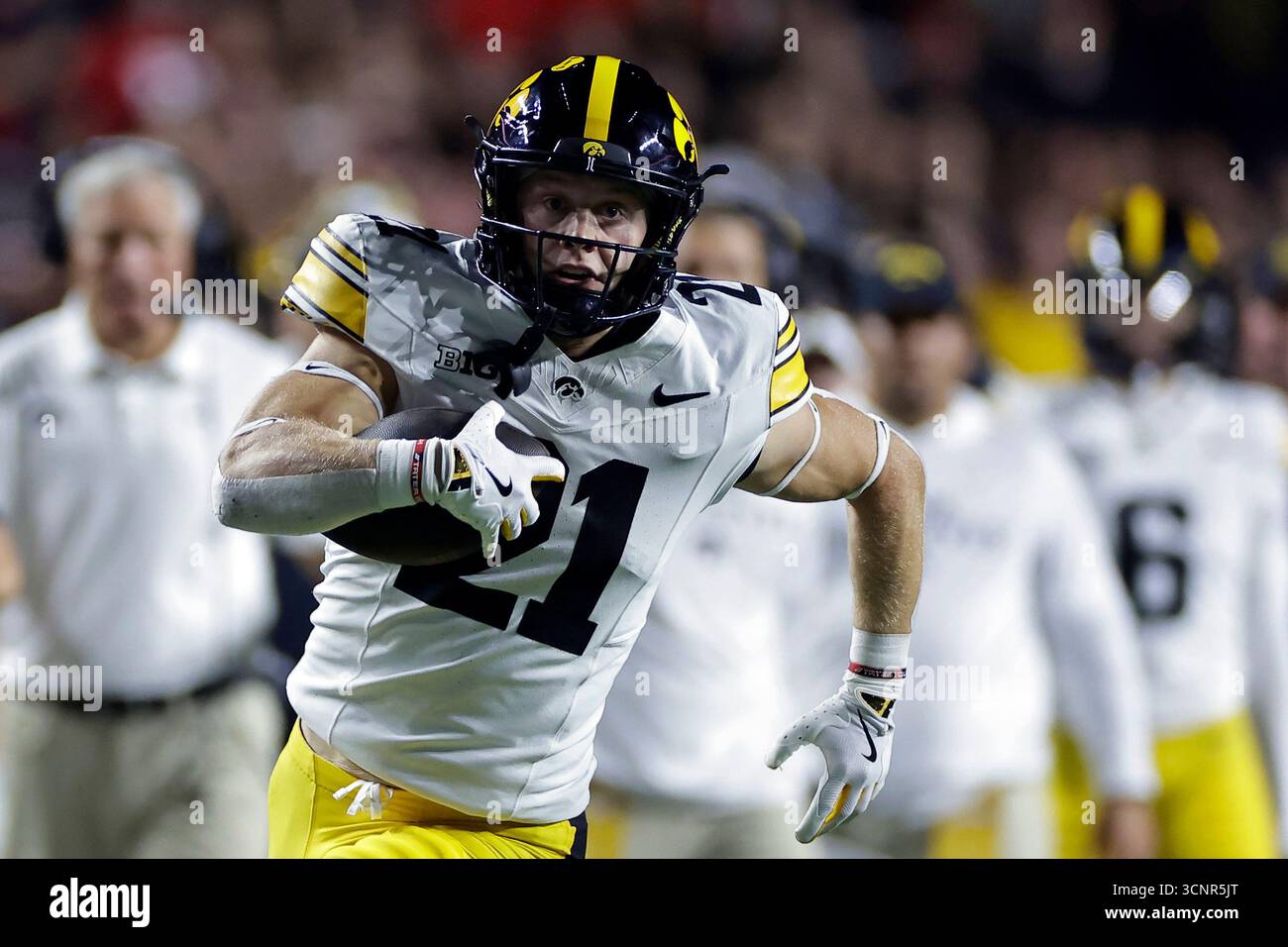 Iowa wide receiver Kaden Wetjen (21) runs with the ball during an NCAA ...