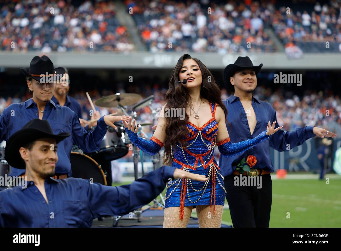 Angelina Victoria, performs at halftime of an NFL football game between ...