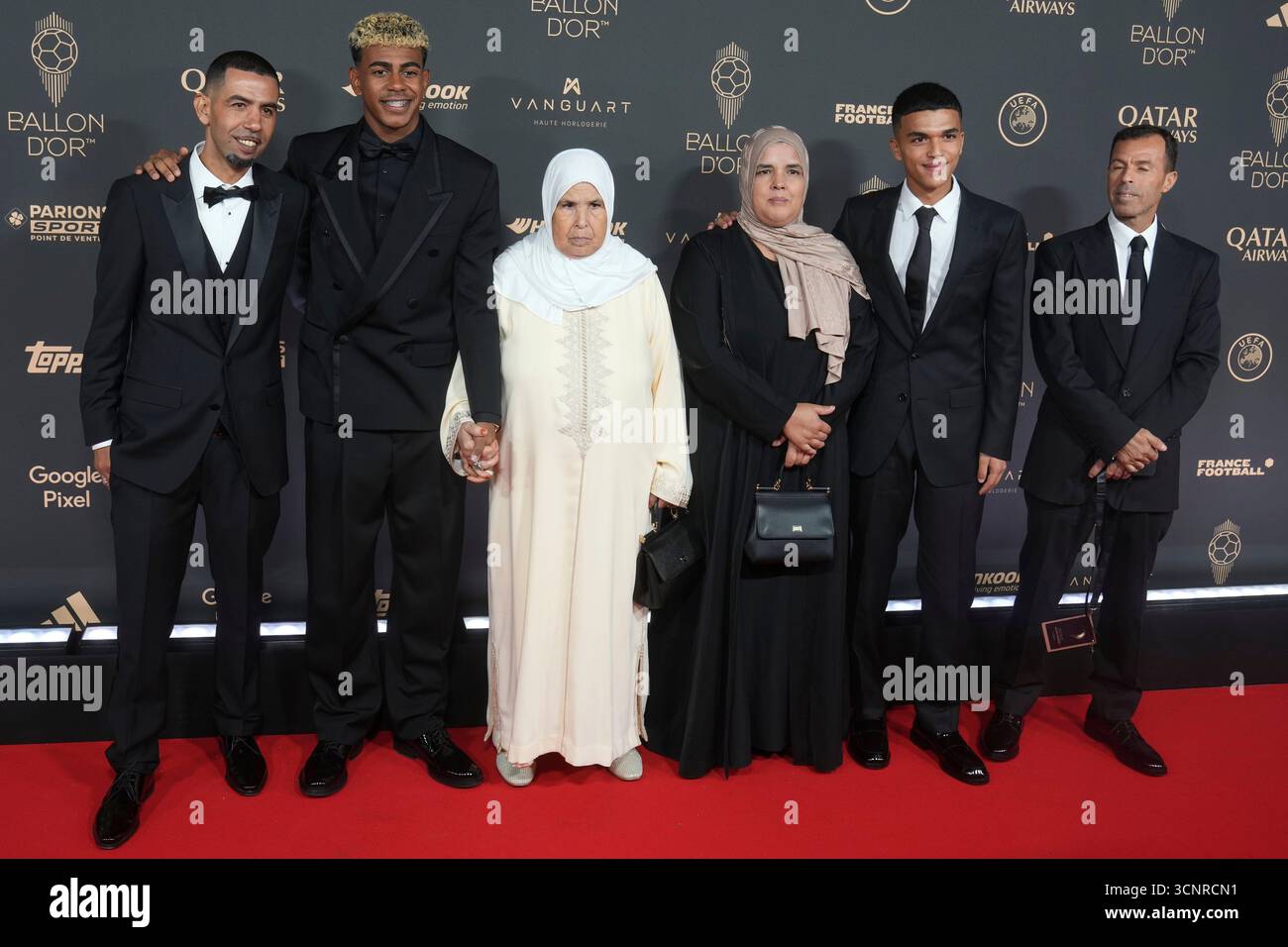 Barcelona's Lamine Yamal poses with members of his family as he arrives ...