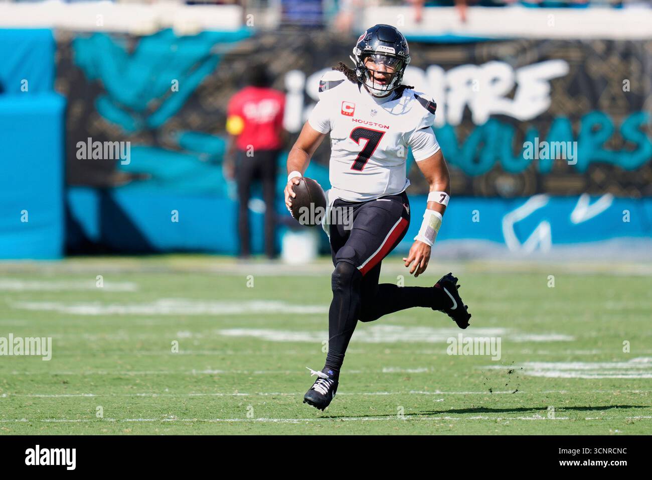 Houston Texans quarterback CJ. Stroud (7) scrambles against the ...