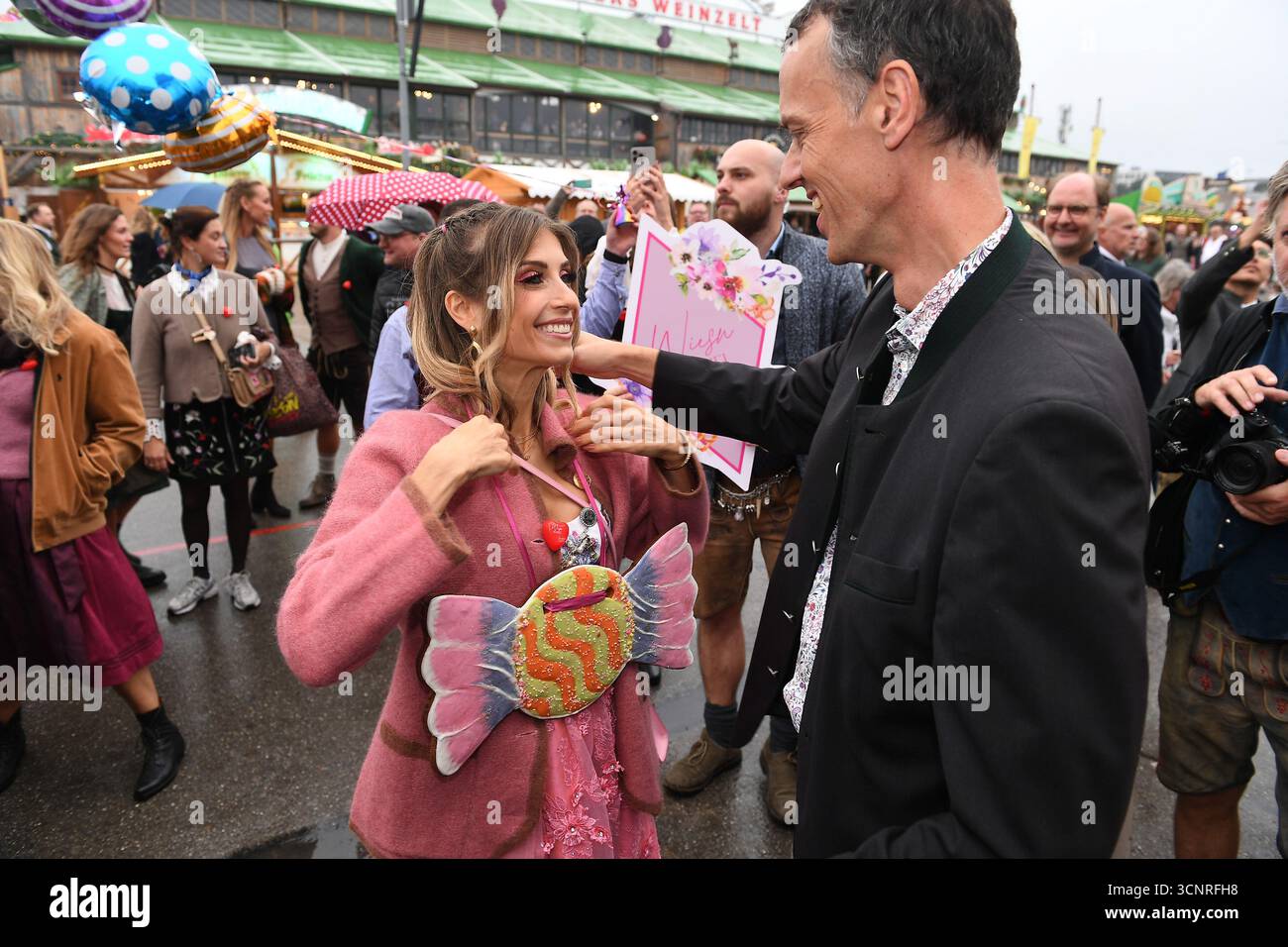 22 September 2025, Bavaria, Munich: Cathy Hummels is greeted by Magnus ...
