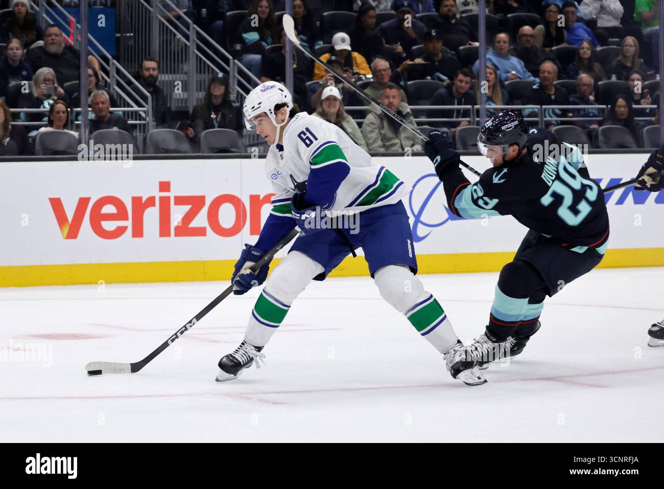 Vancouver Canucks right wing Chase Stillman (61) skates to the goal ...