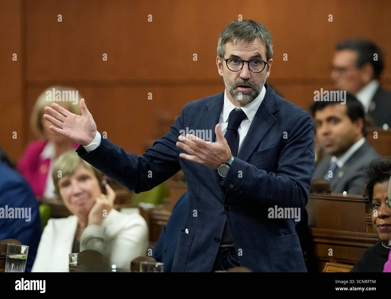Canadian Identity and Culture Minister Steven Guilbeault rises during ...