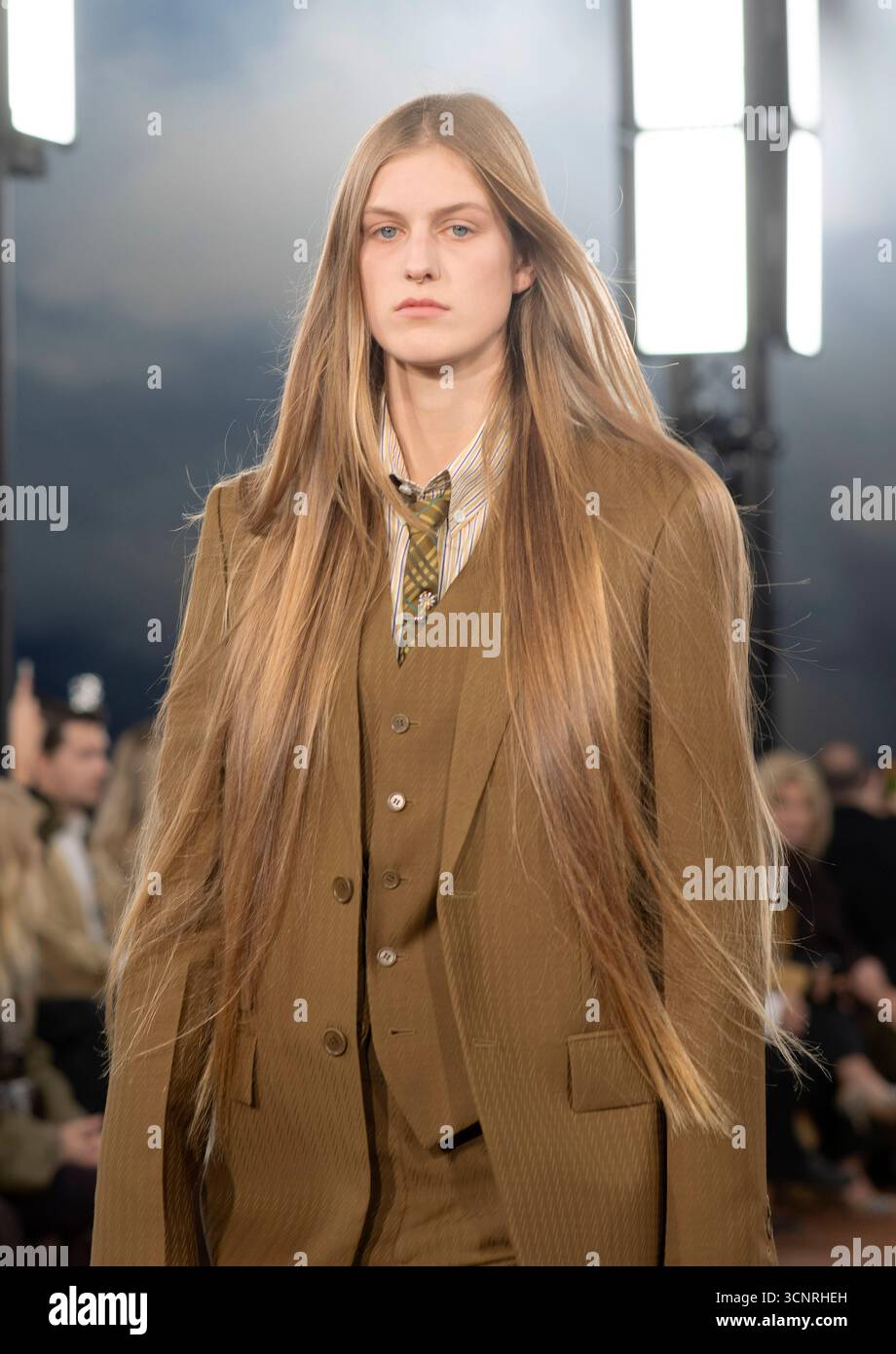 A model on the catwalk at the Burberry show in Perks Field, Kensington ...