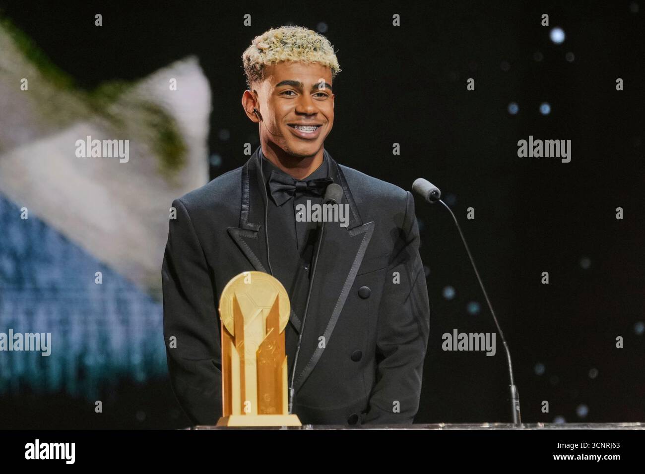 Barcelona's Spanish player Lamine Yamal receives the Kopa Trophy during ...