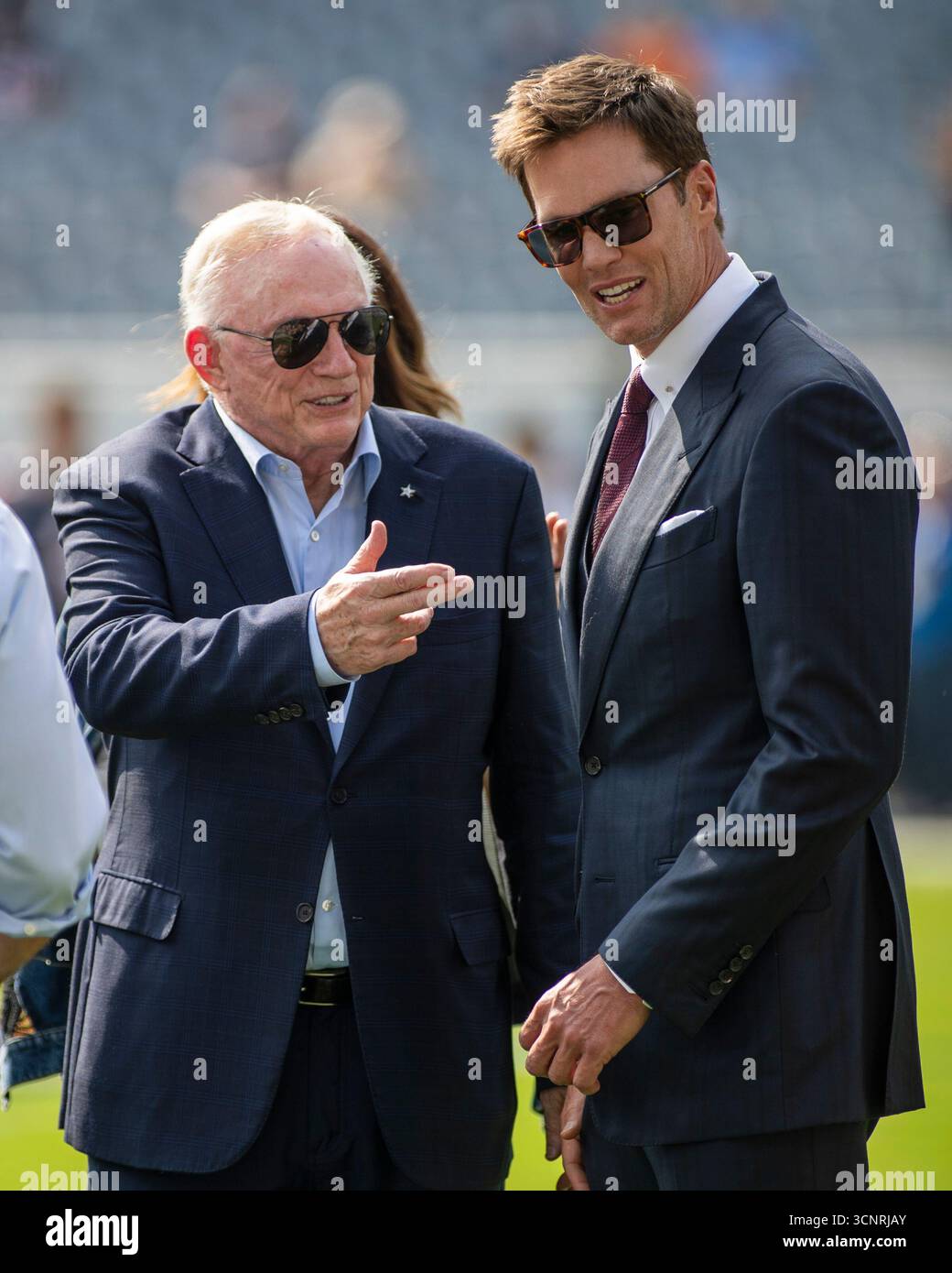 September 21, 2025: Retired Quarterback Tom Brady (right) talks with ...