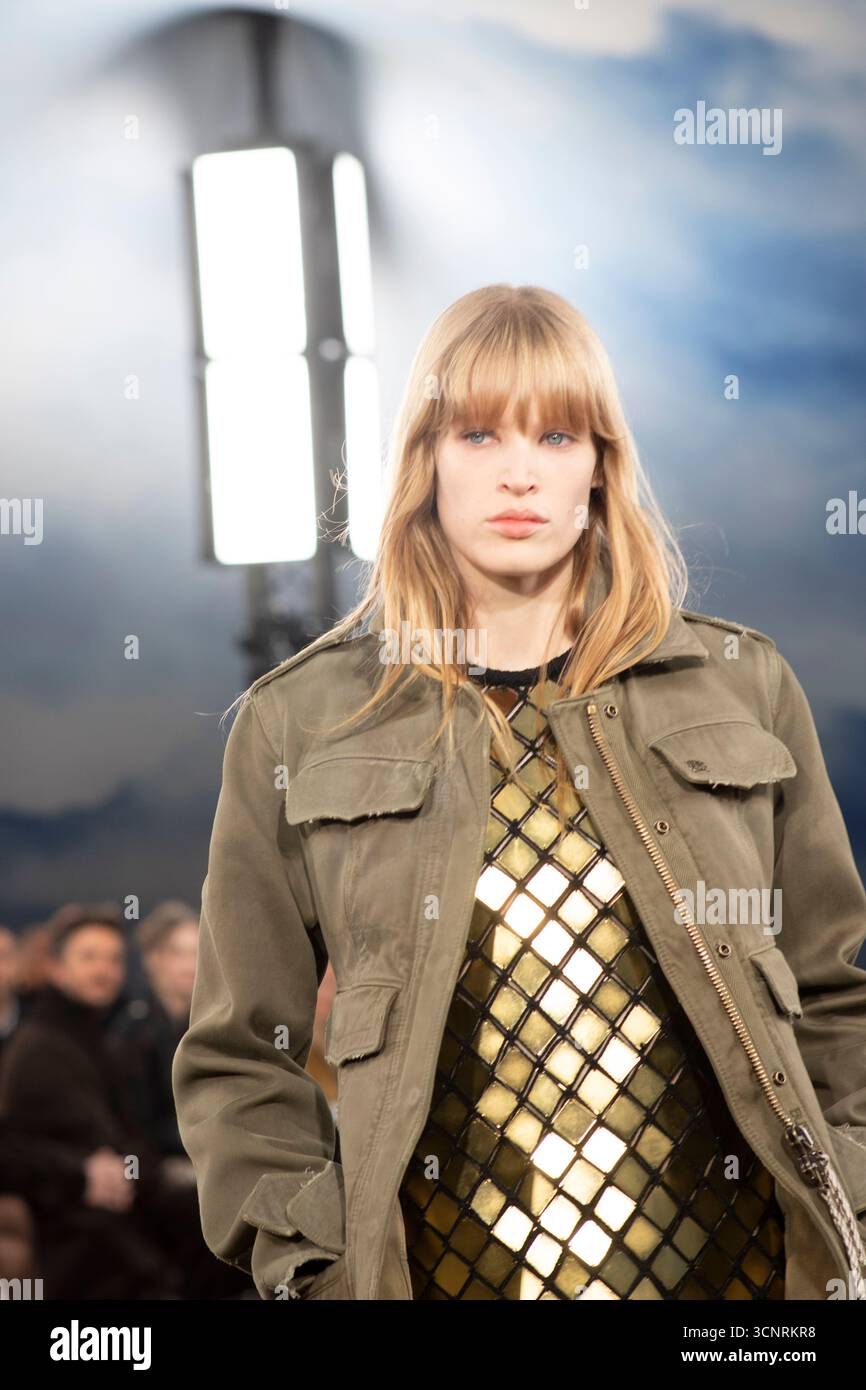 A model on the catwalk at the Burberry show in Perks Field, Kensington ...