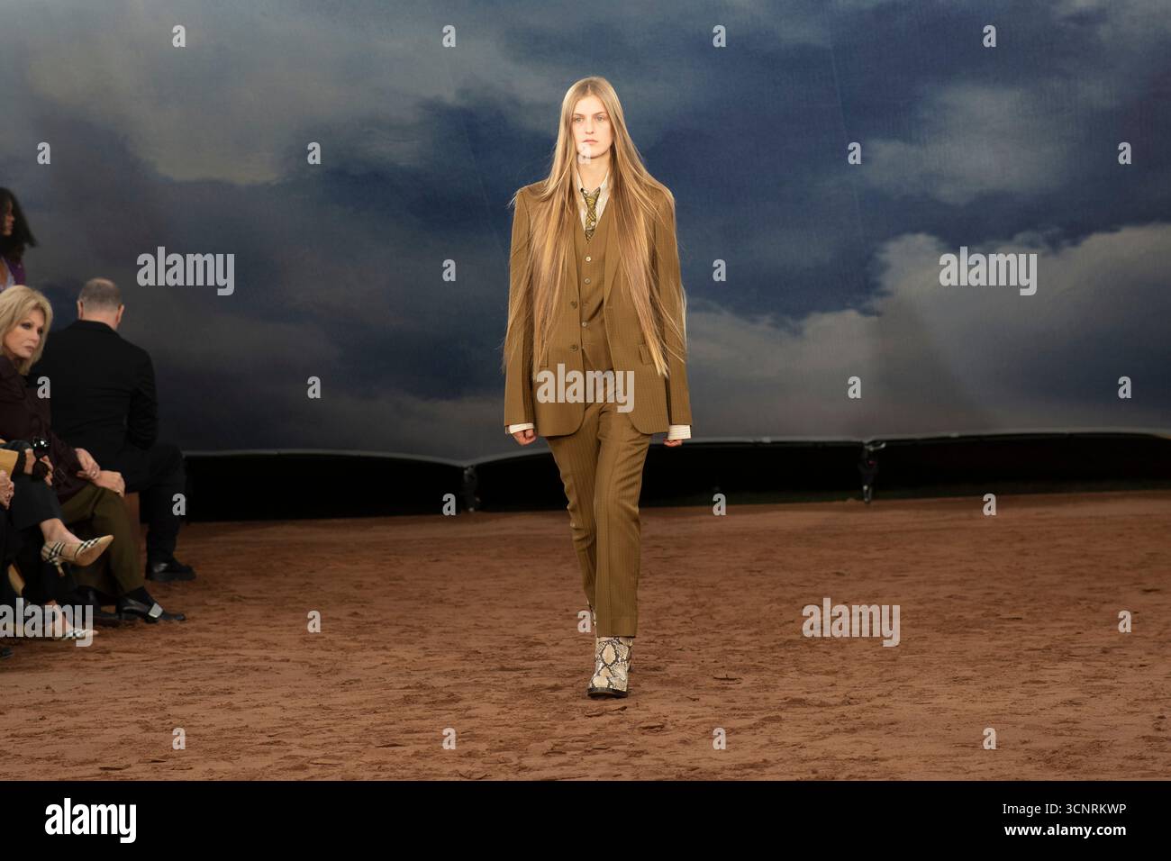 A model on the catwalk at the Burberry show in Perks Field, Kensington ...