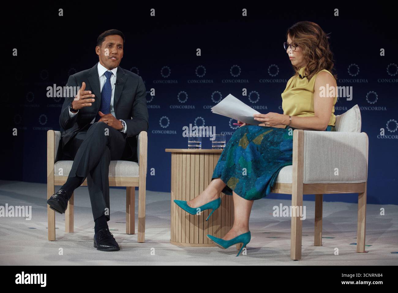 Rajiv Shah president of The Rockefeller Foundation, left, talks to ...