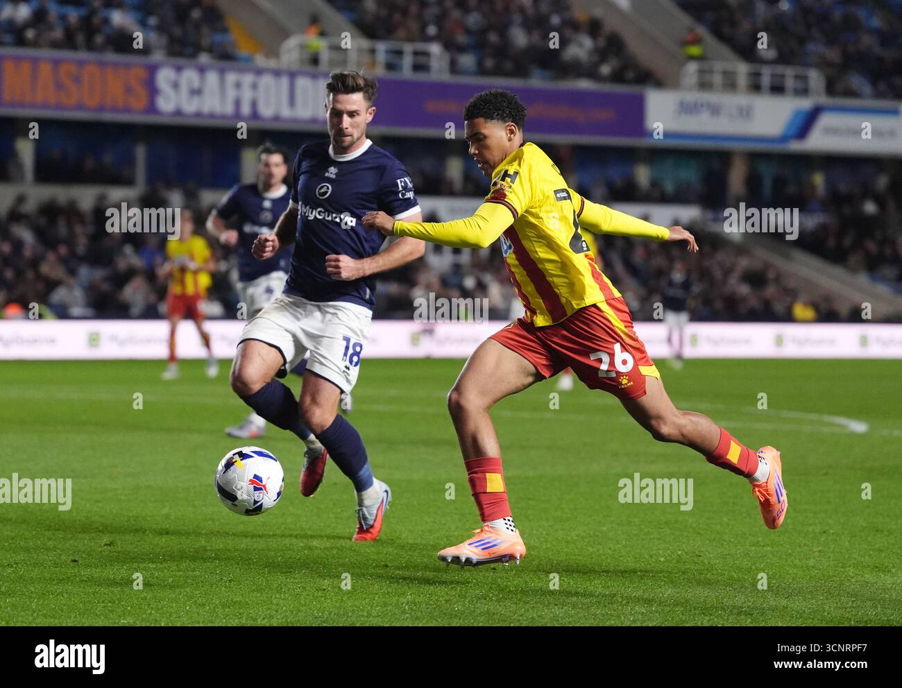 Millwall's Ryan Leonard and Watford's Caleb Wiley battle for the ball ...