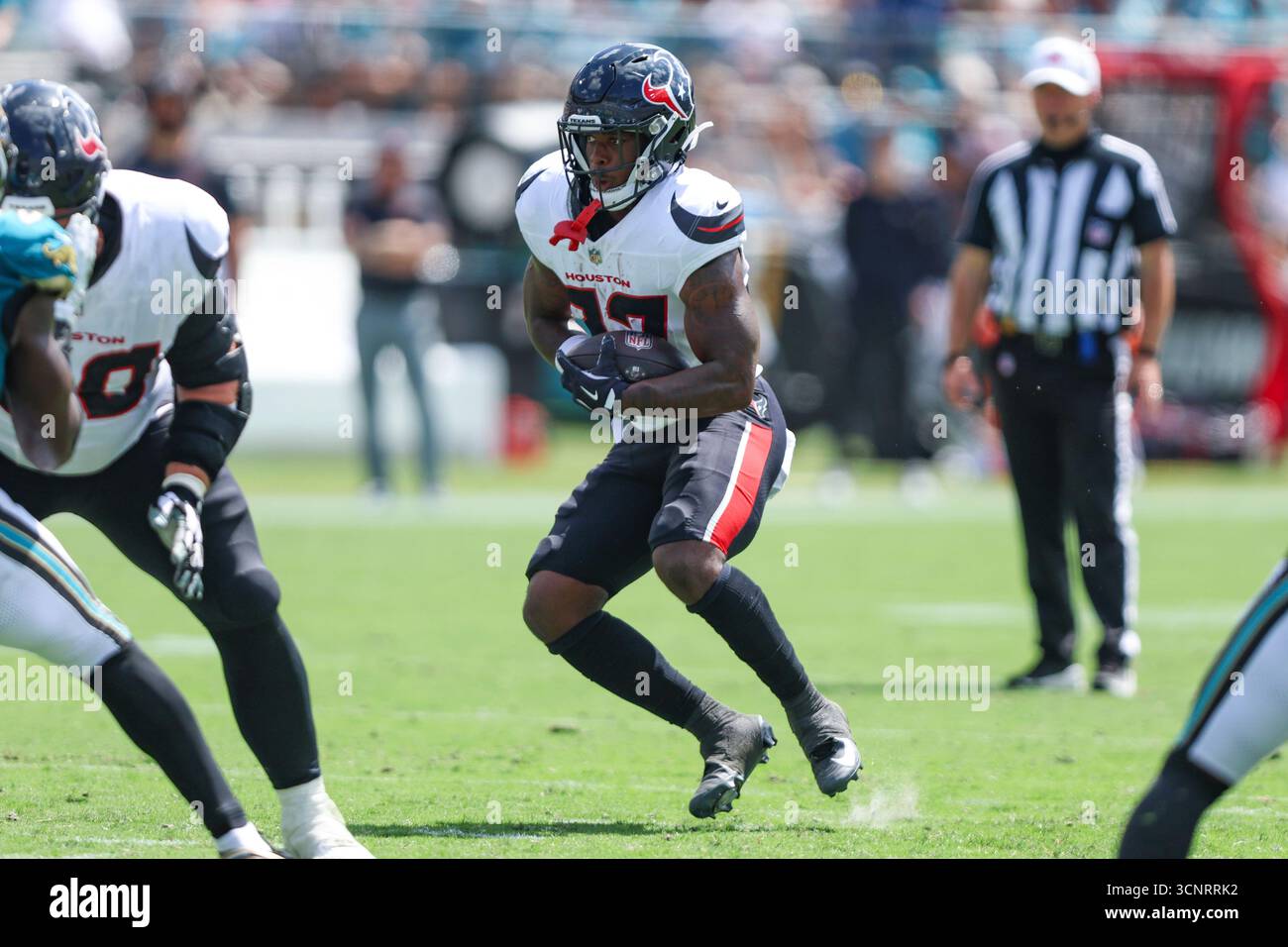 Houston Texans running back Woody Marks (27) runs the ball during an ...