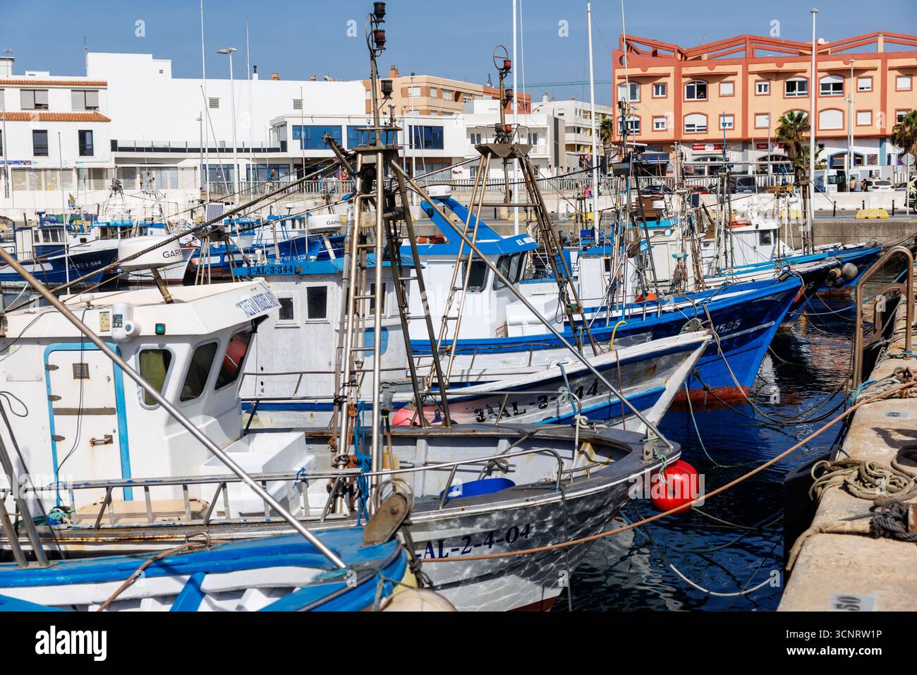 21 September 2025, Spain, Tarifa: Numerous fishing boats are moored at ...