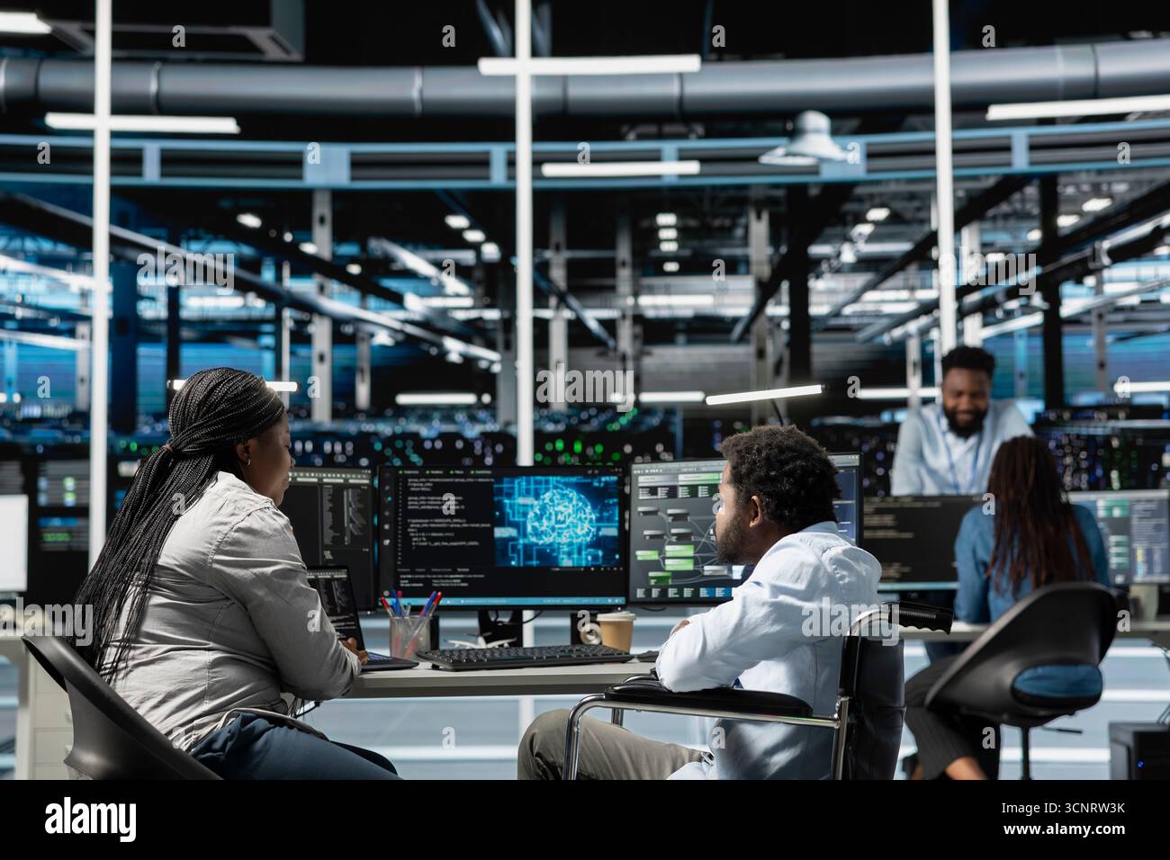 Developer with paraplegia and manager inspect neural network data ...