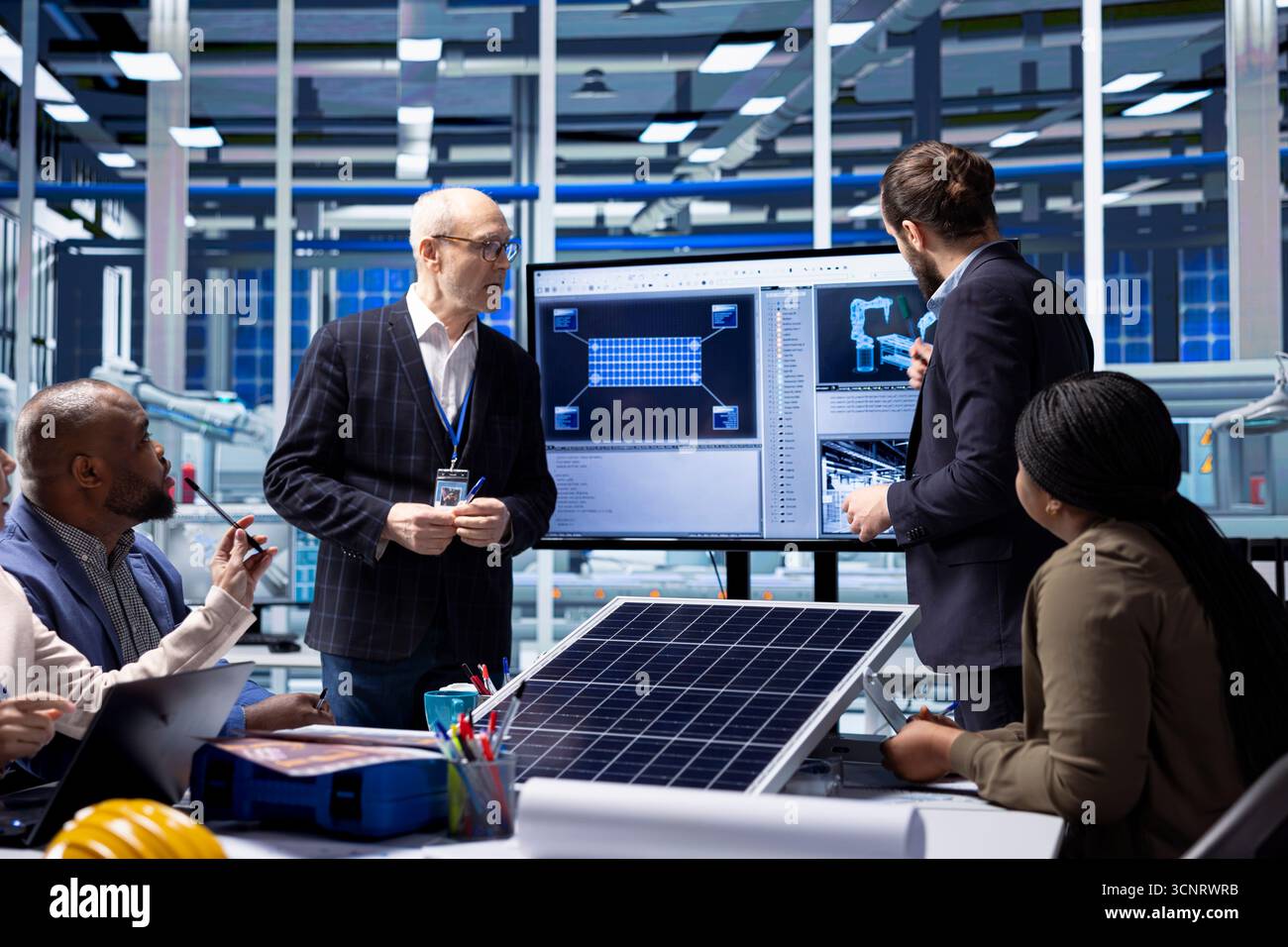 Factory executives discuss solar panel research and development ...