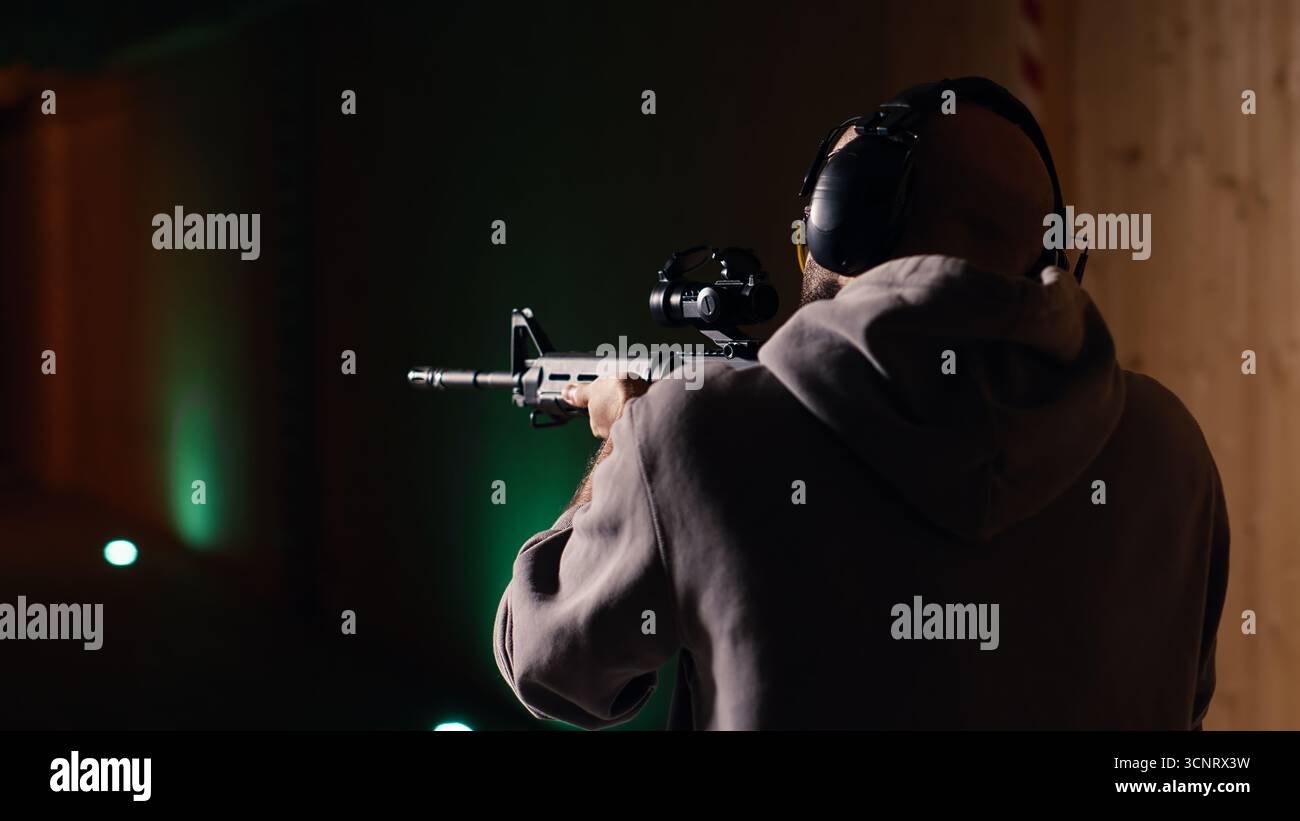 Shooting range customer shooting targets with semiautomatic weapon ...