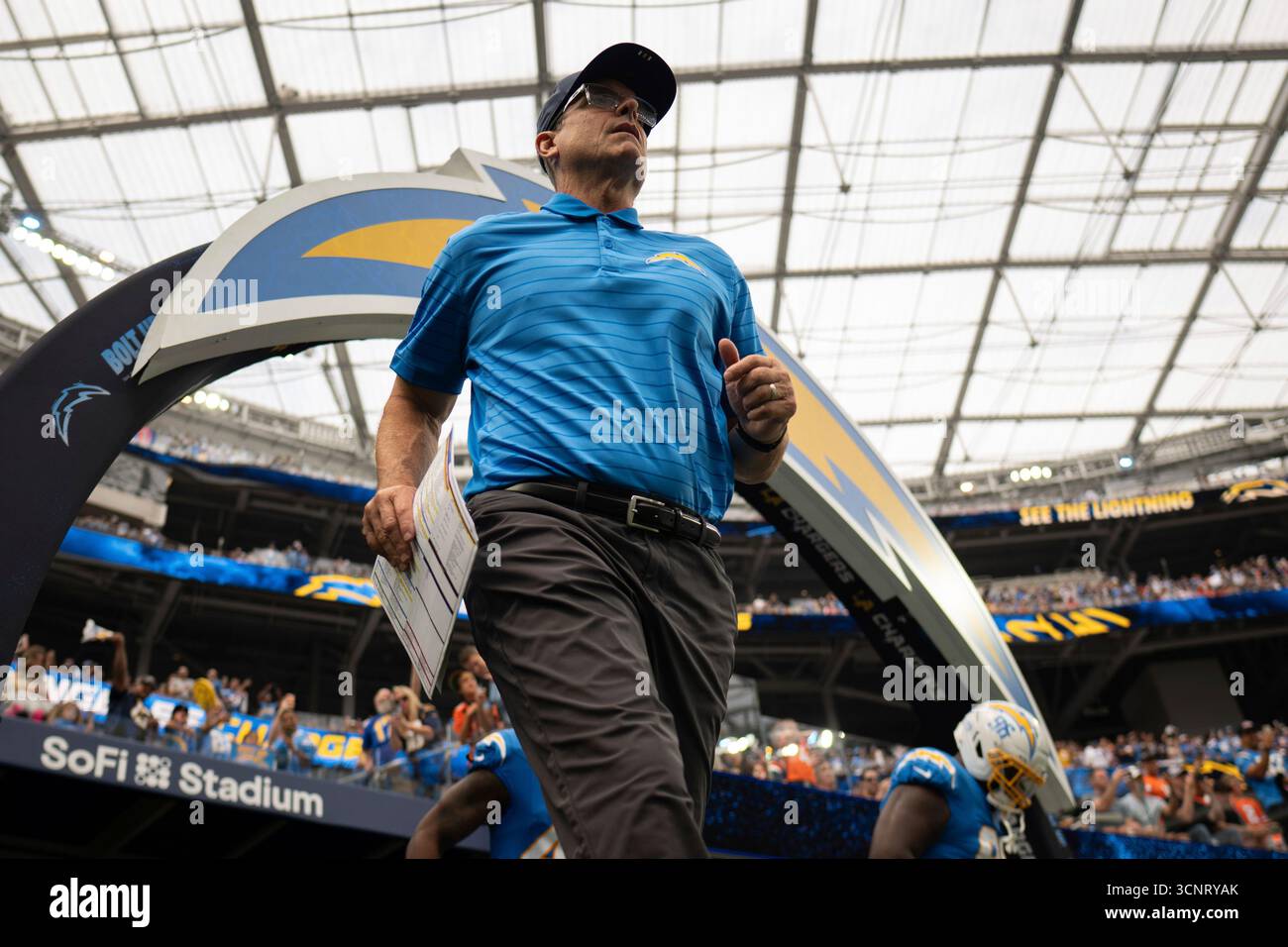 Los Angeles Chargers head coach Jim Harbaugh enters the field before ...