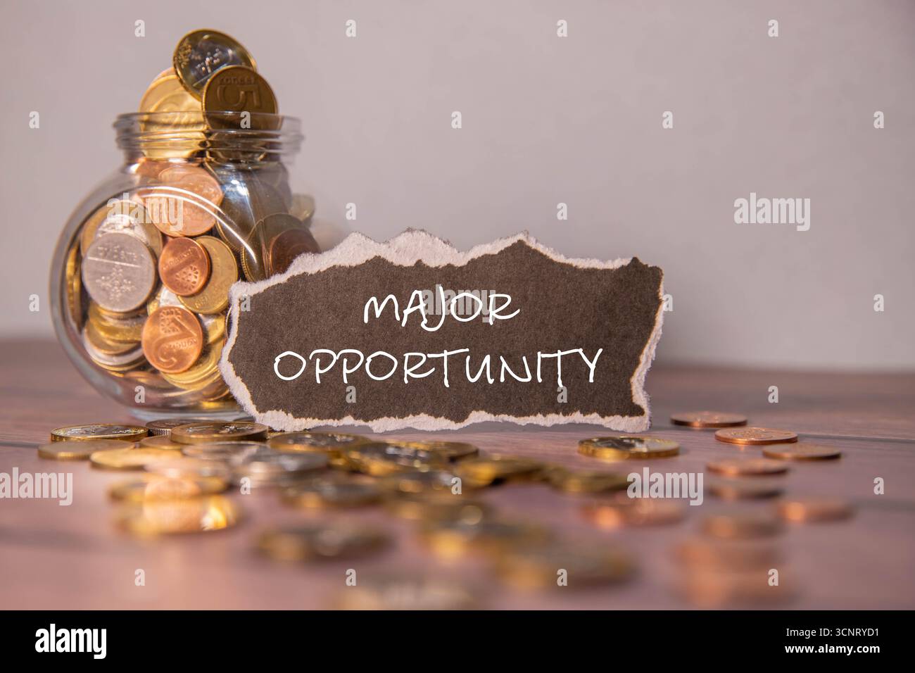 Closeup on businessman holding a card with text MAJOR OPPORTUNITY ...