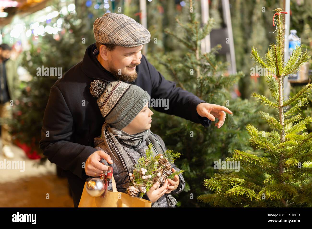 Father son choose christmas tree hi-res stock photography and images ...