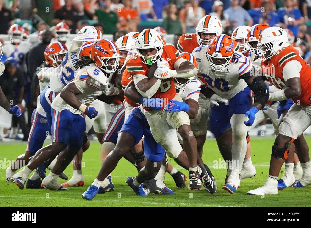 Miami running back CharMar Brown (6) runs for a first down during the ...