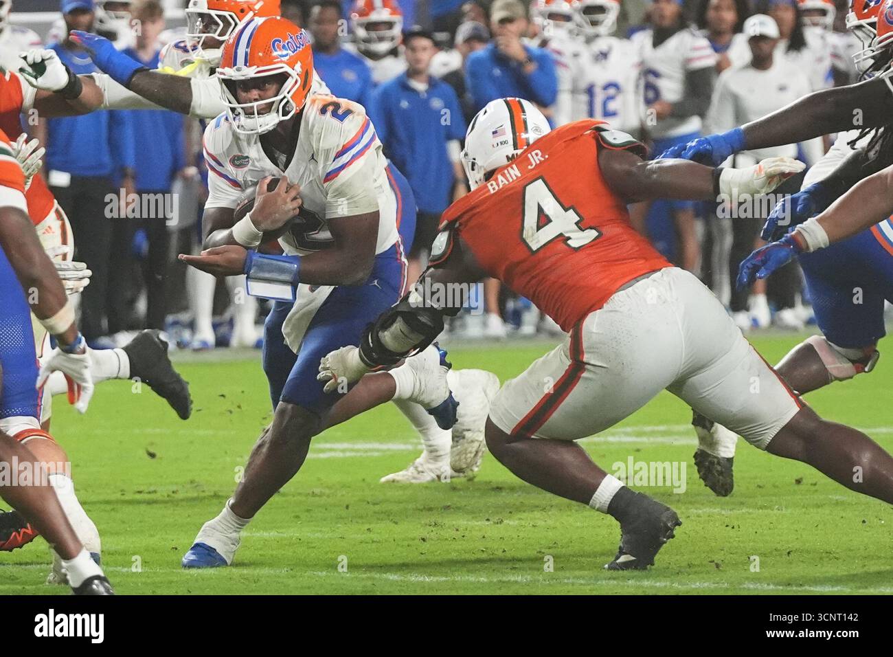 Florida quarterback DJ Lagway (2) runs as Miami defensive lineman ...