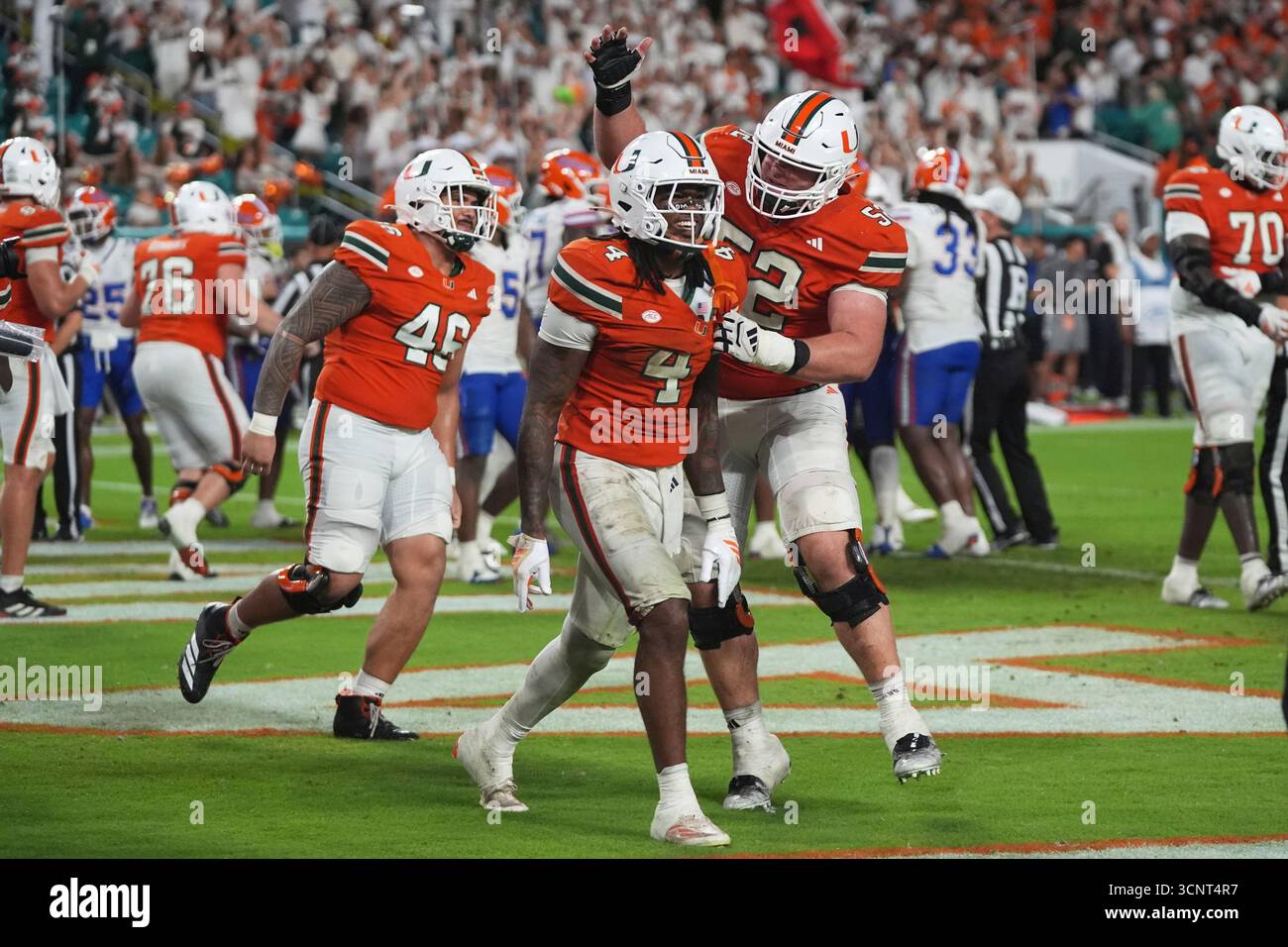 Miami running back Mark Fletcher Jr. (4) celebrates with offensive ...