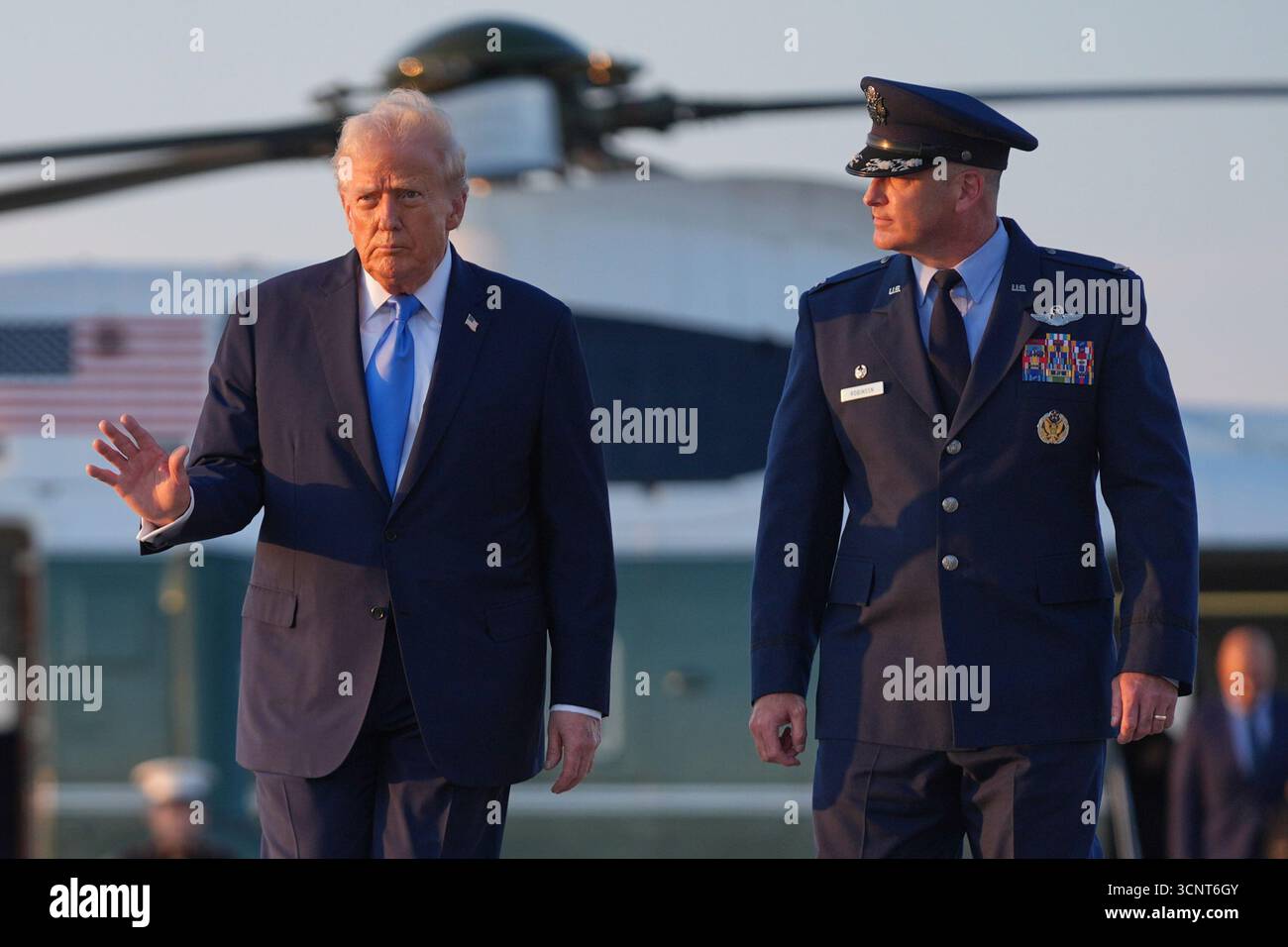 President Donald Trump walks from Marine One with Col. Christopher ...
