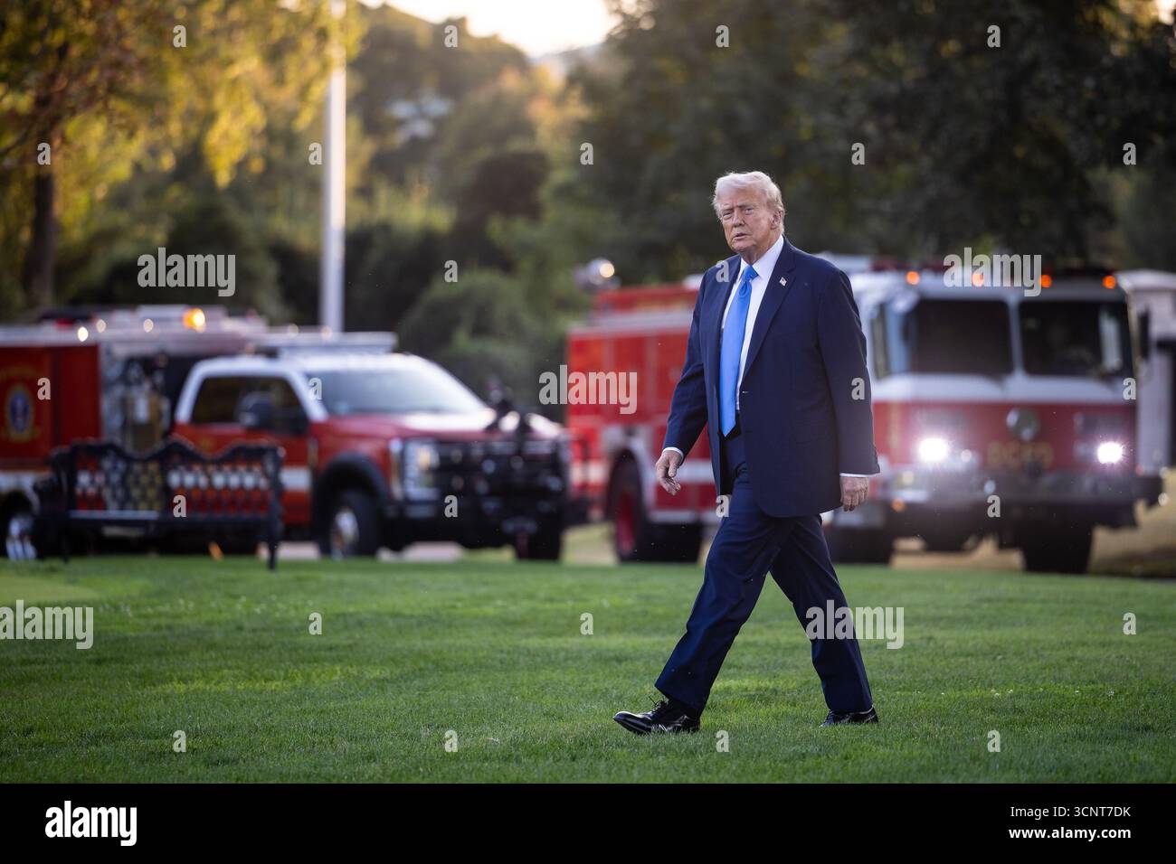President Donald Trump walks on the South Lawn of the White House to ...