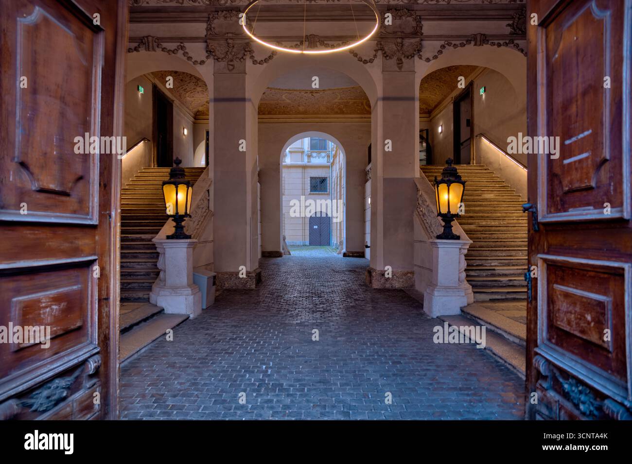 Elegant baroque entrance hall with twin staircases, antique lanterns ...