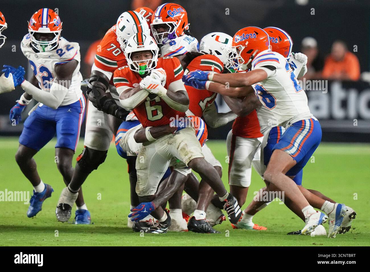 Miami running back CharMar Brown (6) runs for a first down during the ...