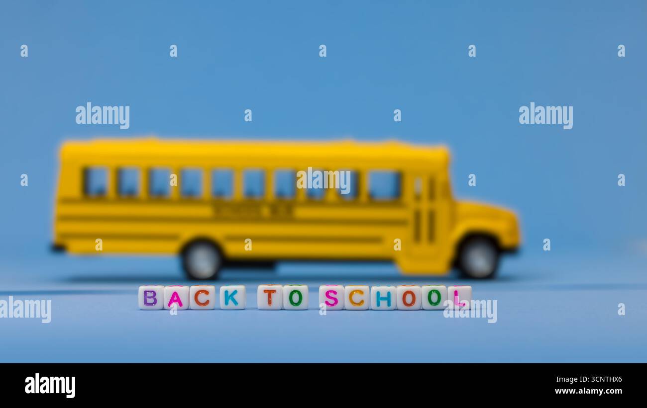 Back to School spelled out on alphabet blocks with school bus toy, Back ...