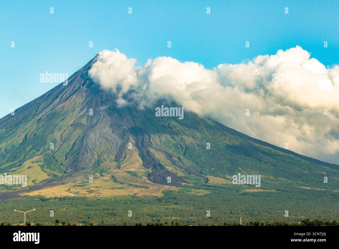 majestic mayon volcano with smoke billowing from its crater in albay ...