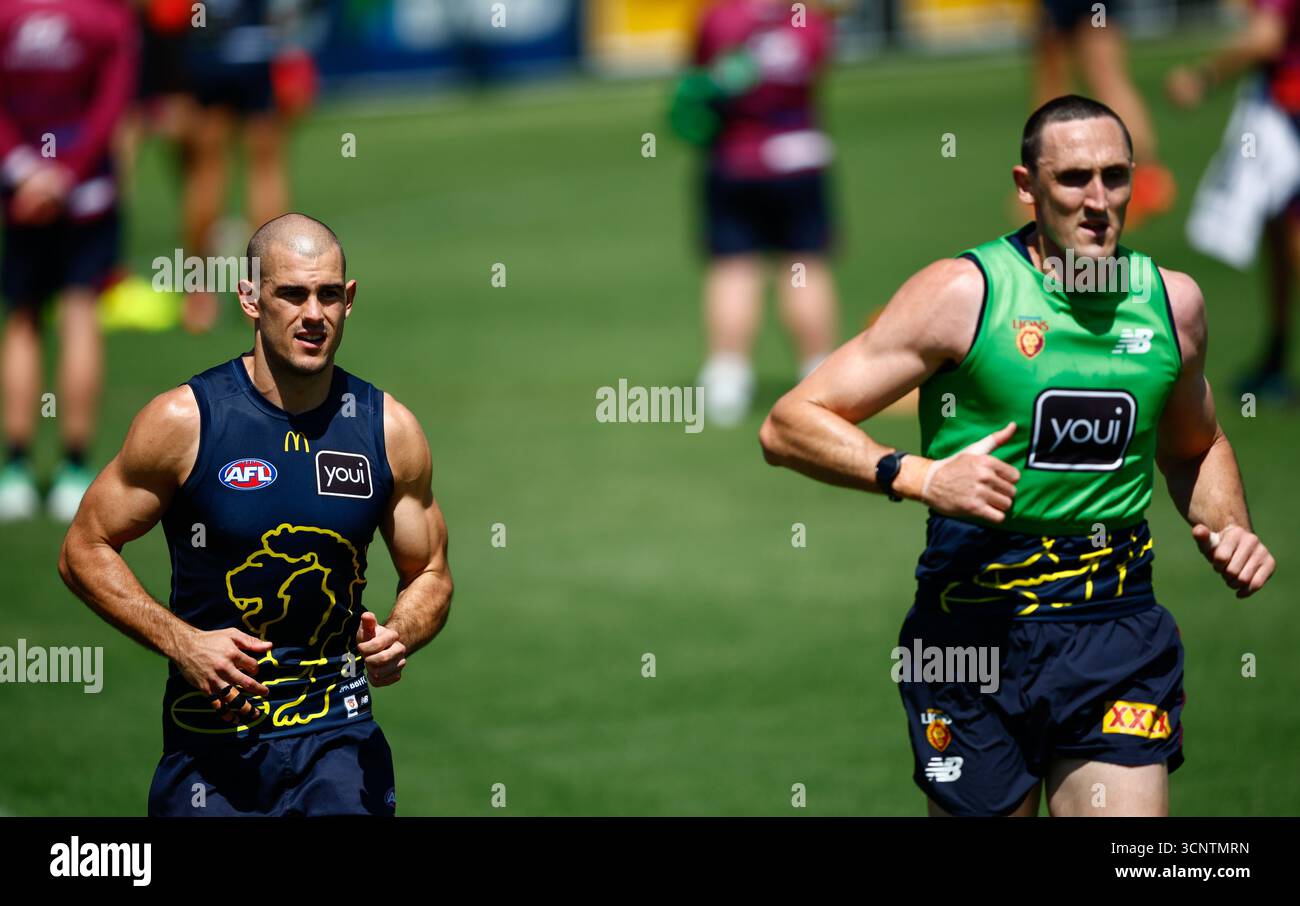 Brandon Starcevich (left) and Oscar McInerney (right) of the Lions are ...