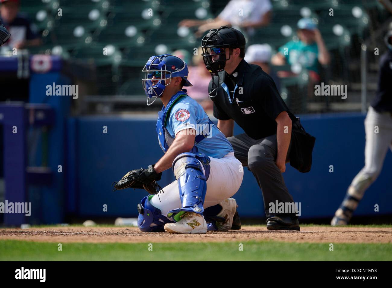 Umpire Charlie Welling and Buffalo Bisons catcher Brandon Valenzuela ...