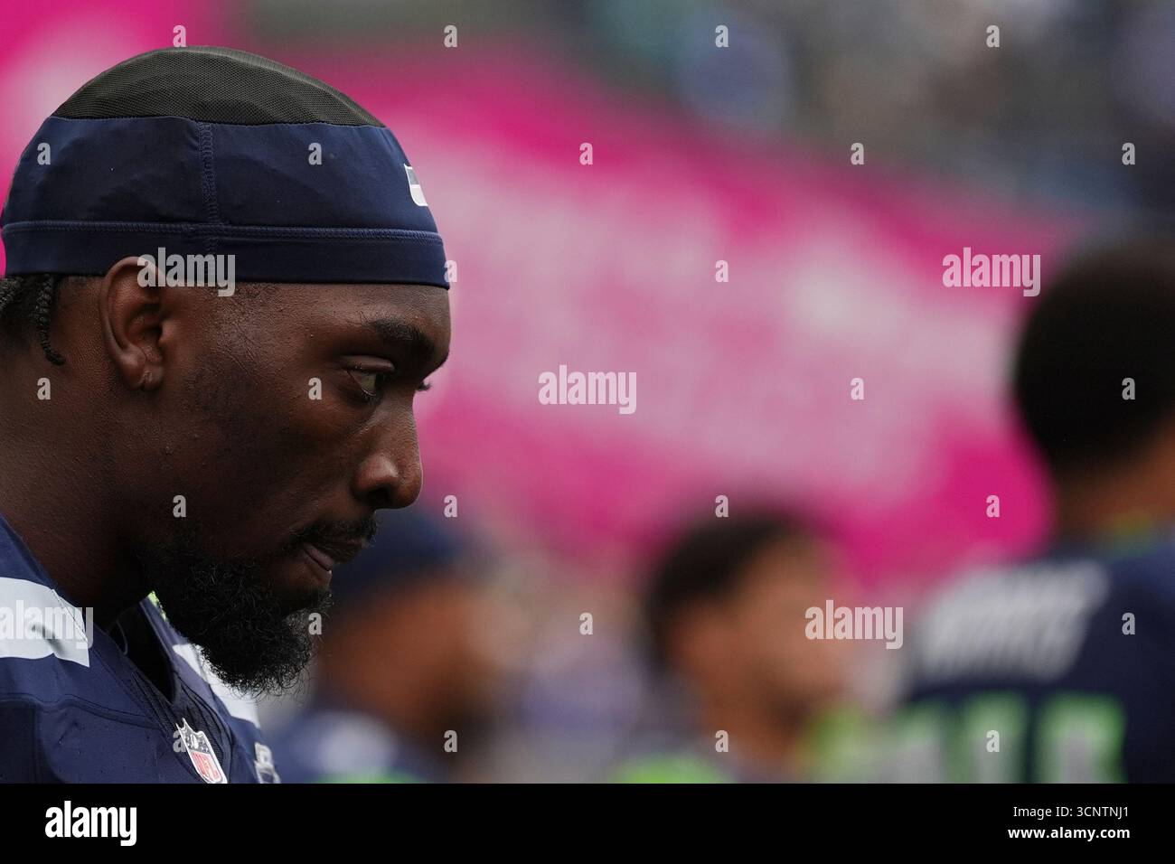 Seattle Seahawks linebacker DeMarcus Lawrence stands on the sideline ...