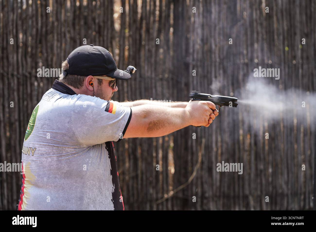 (250923) -- MATLOSANA, Sept. 23, 2025 (Xinhua) -- A competitor fires at ...