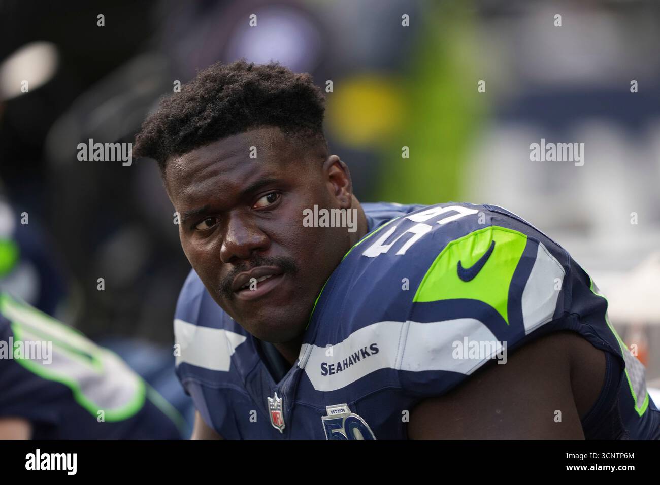 Seattle Seahawks center Olu Oluwatimi (55) looks on from the bench ...
