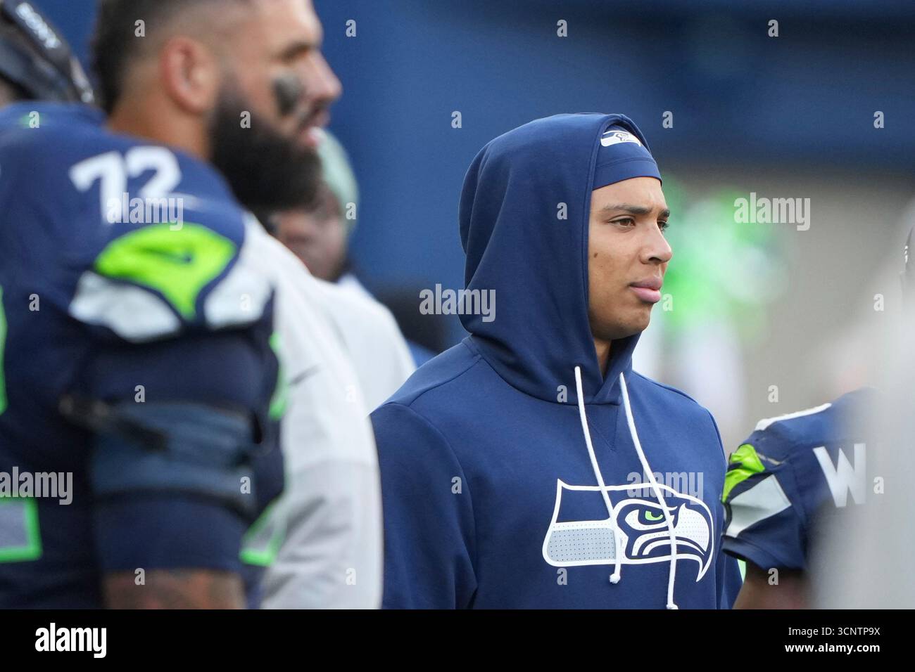 Seattle Seahawks running back Zach Charbonnet stands on the sideline ...