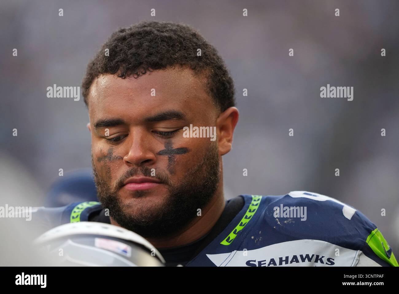 Seattle Seahawks defensive end Mike Morris walks on the sideline during ...