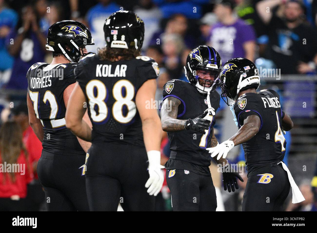 Baltimore Ravens wide receiver Rashod Bateman, center, reacts with wide ...