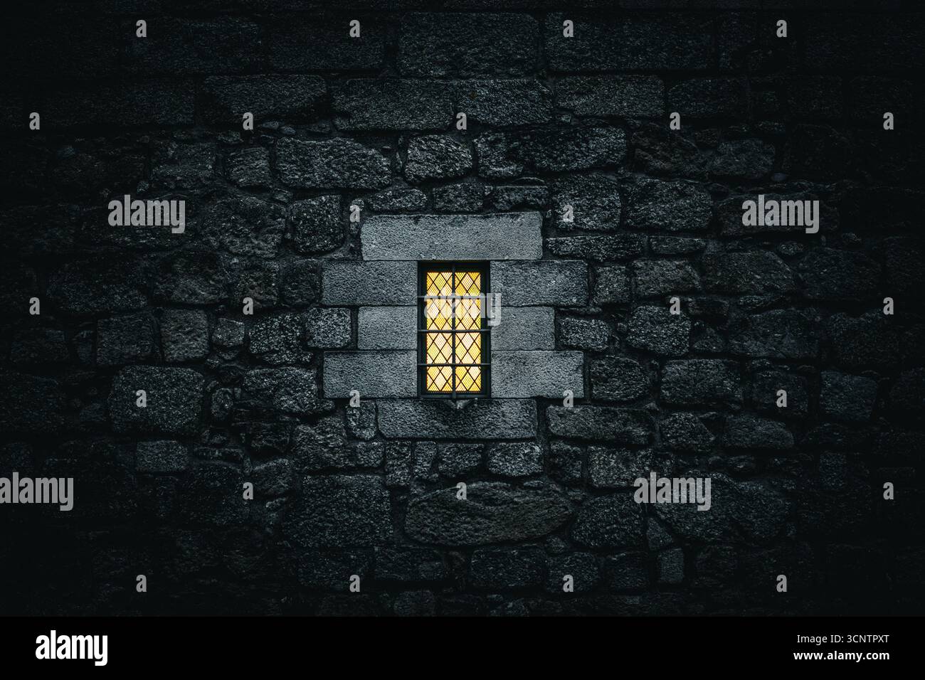 Illuminated Small Window in a Rough Stone Wall Stock Photo - Alamy