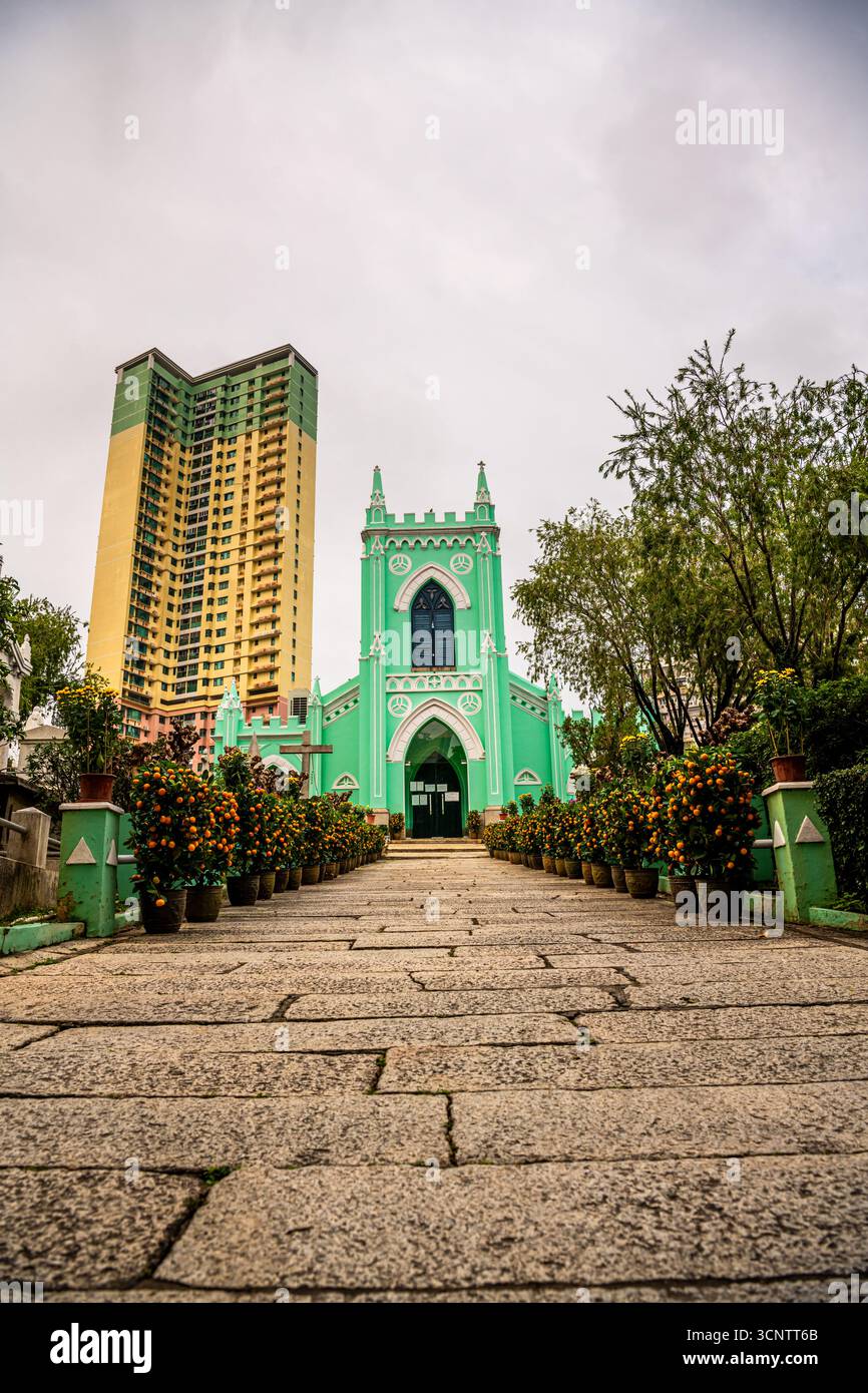 Cemetery in Macao with tall buildings in the background Stock Photo - Alamy