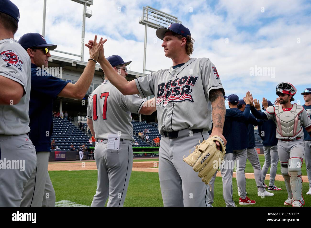 Lehigh Valley IronPigs pitcher Nolan Hoffman (38) high fives coach Phil ...