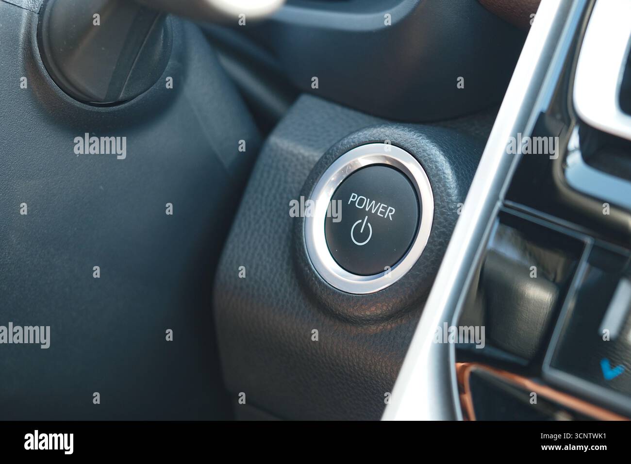 Power button inside a modern car dashboard design Stock Photo - Alamy